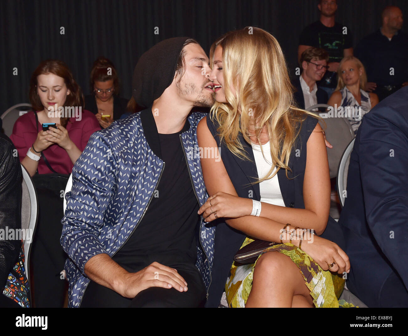 Berlin, Germany. 08th July, 2015. British actor Tom Payne kisses his ...