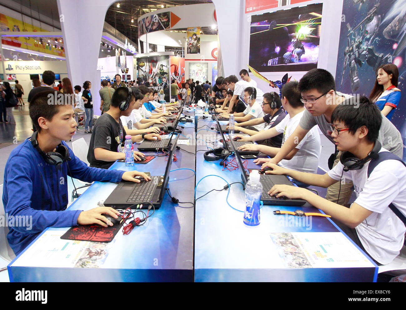 Shanghai, China. 9th July, 2015. Visitors play computer games during ...