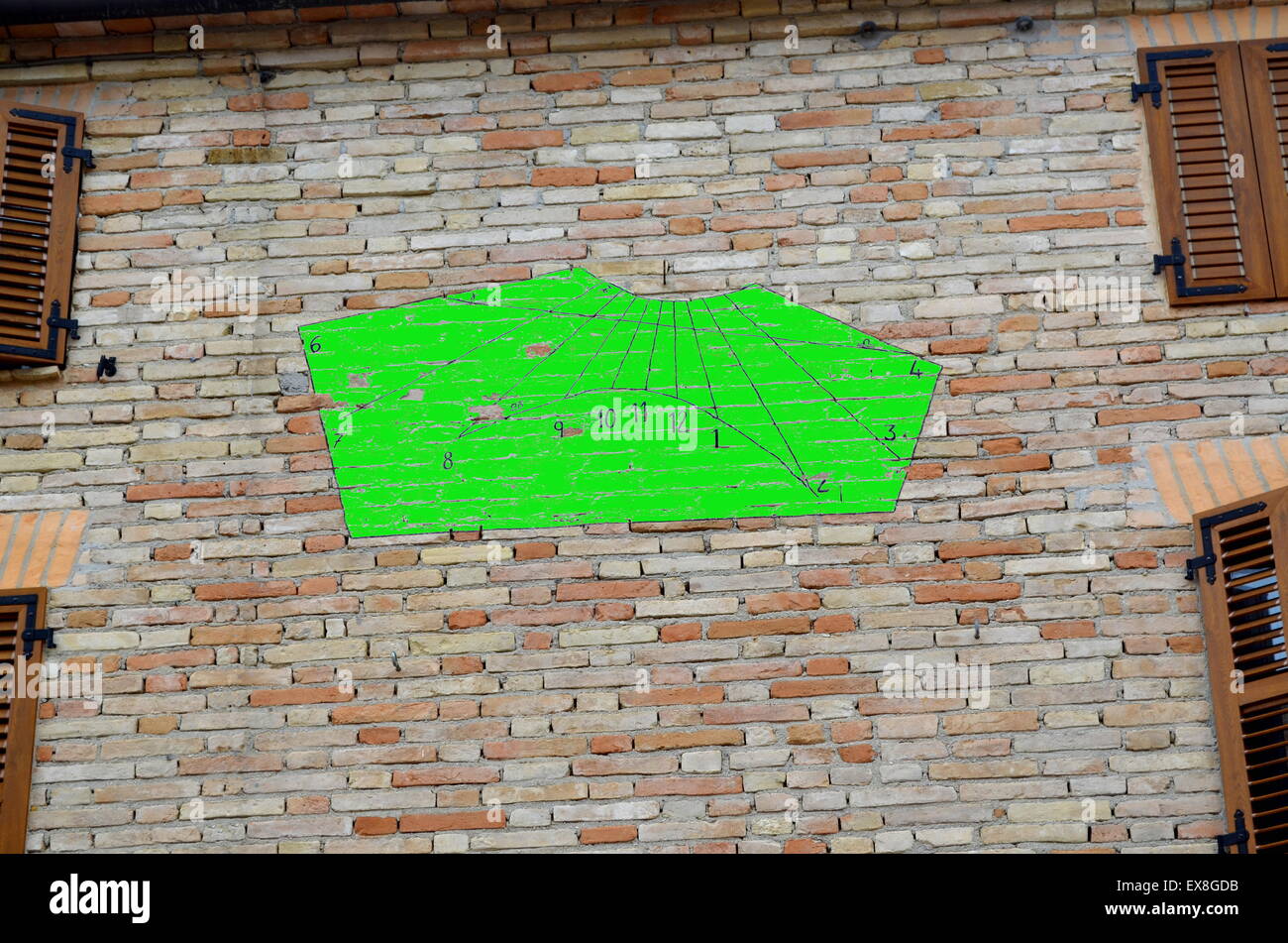 Green sundial on a house wall Stock Photo - Alamy