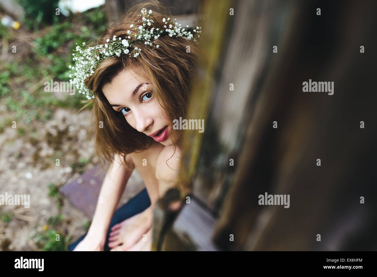 Beautiful girl spying on someone Stock Photo - Alamy