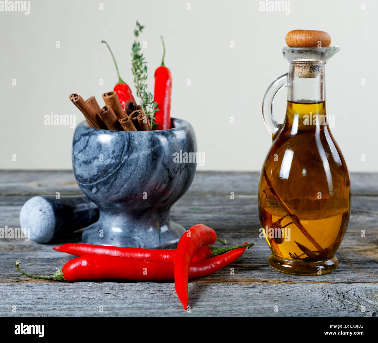 Still-life of spice and mortar on a old wooden table Stock Photo - Alamy