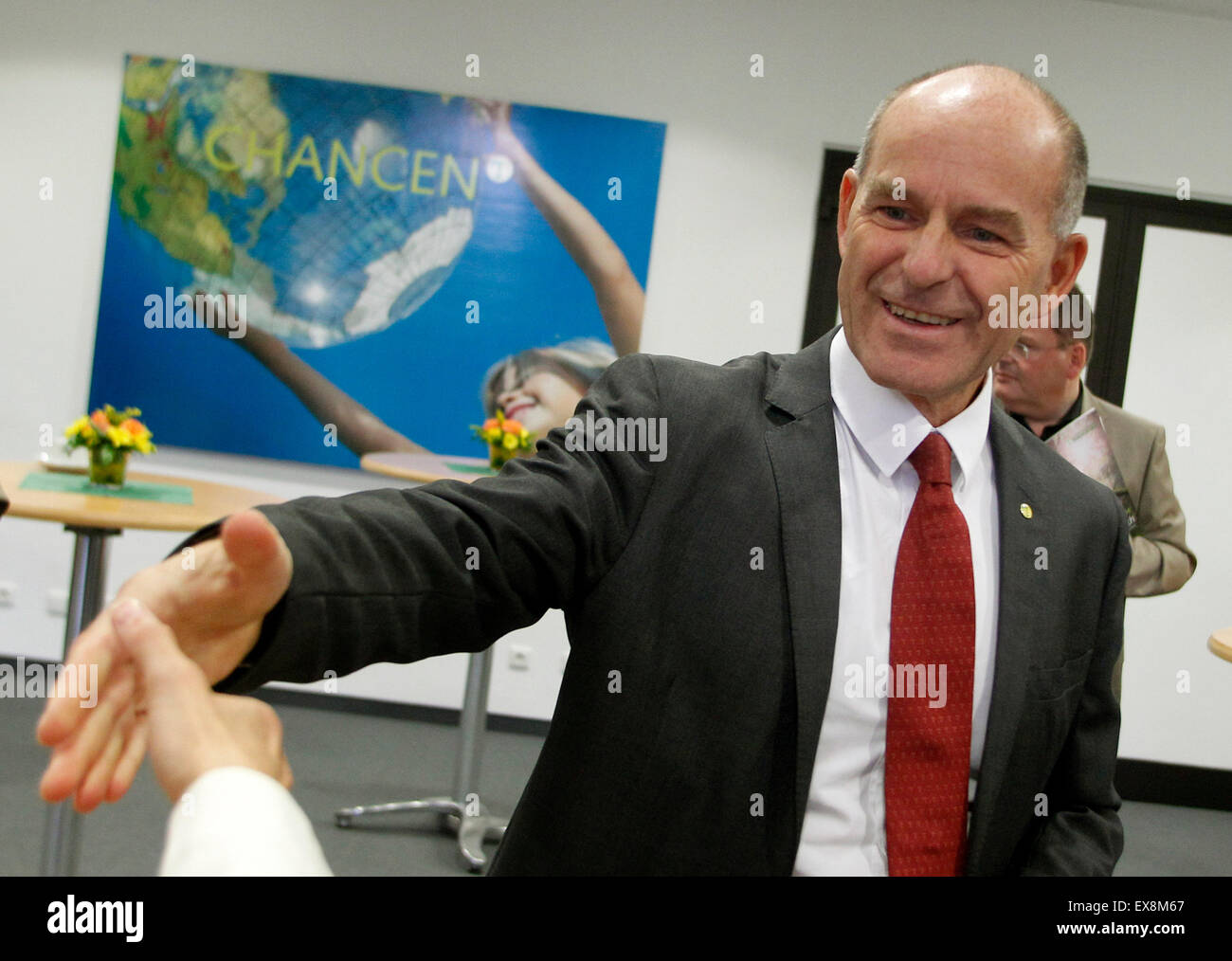 Karl-Erivan Haub, CEO of Tengelmann Group, shakes hands with a ...