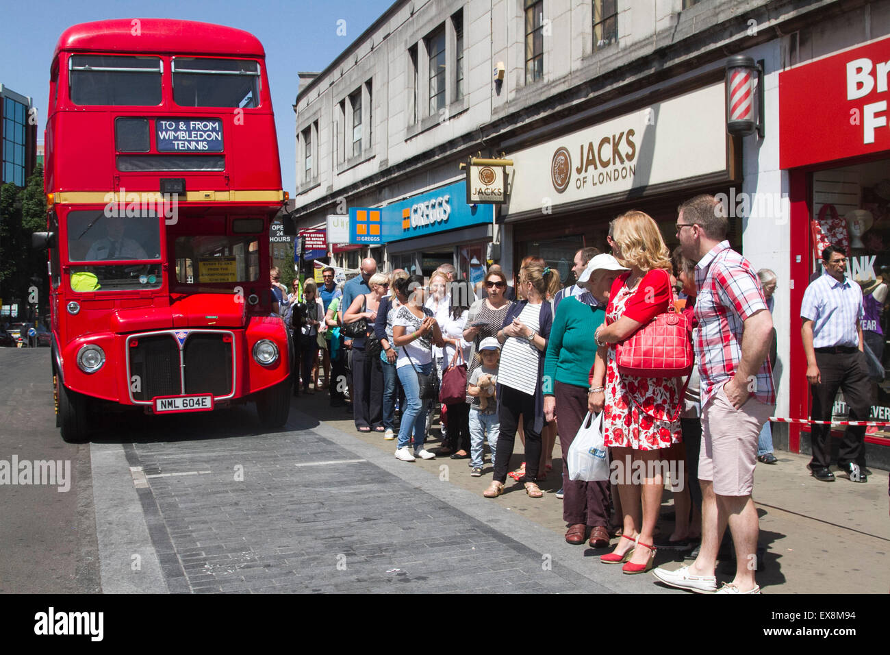Wimbledon, London, UK. 09th July, 2015. Crowds queue to board buses for ...