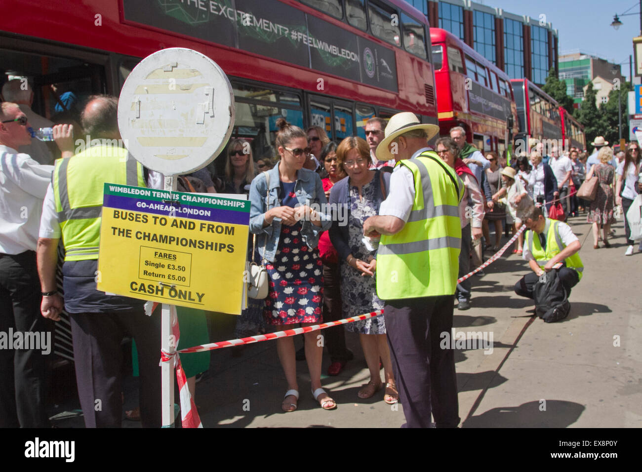 Wimbledon London,UK. 9th July 2015. Crowds queue to board buses for ...