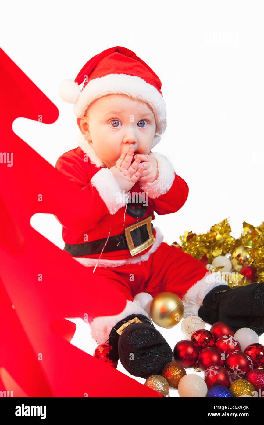Cute baby in father Christmas outfit Stock Photo - Alamy
