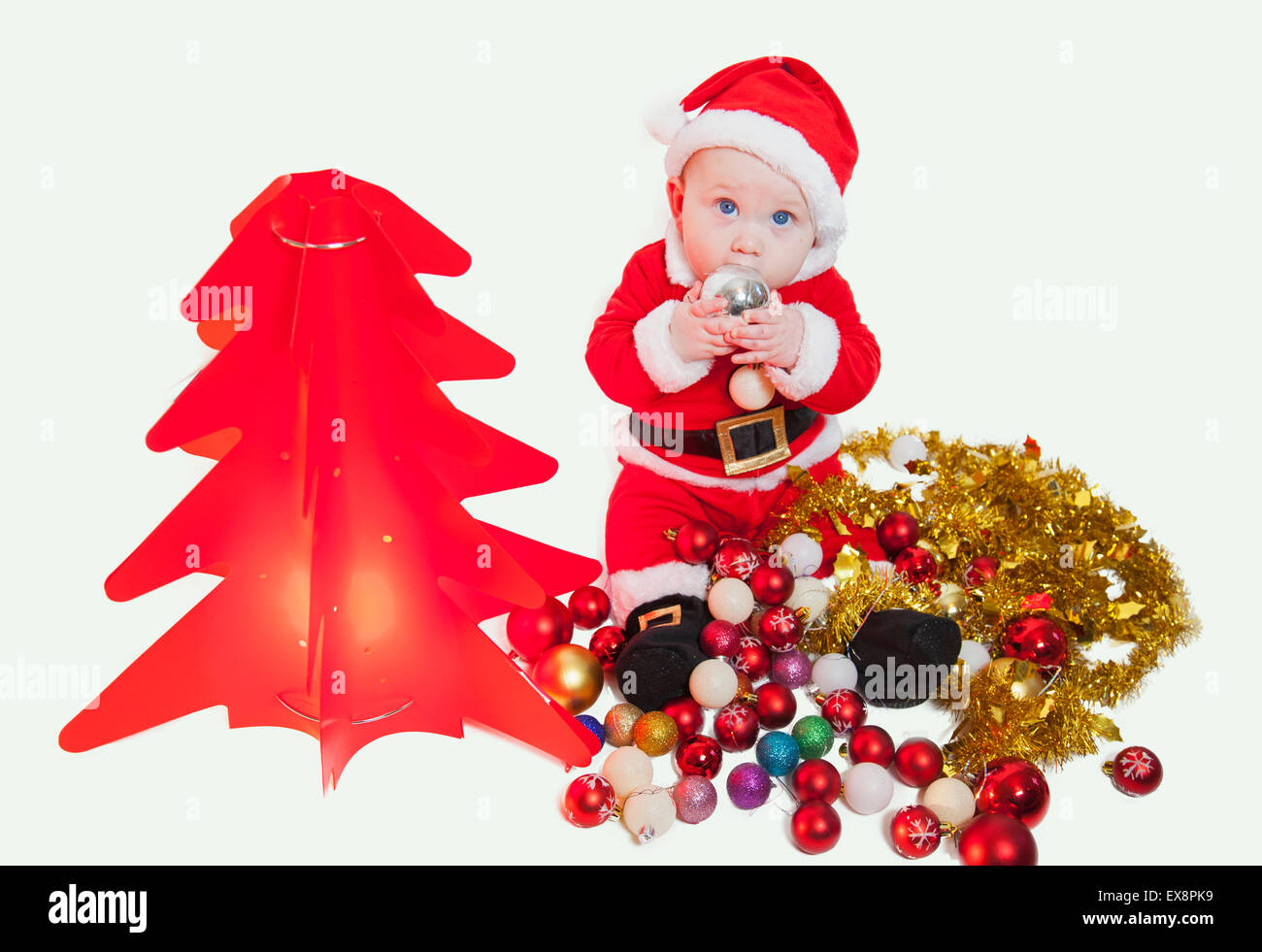 Cute baby in father Christmas outfit Stock Photo - Alamy