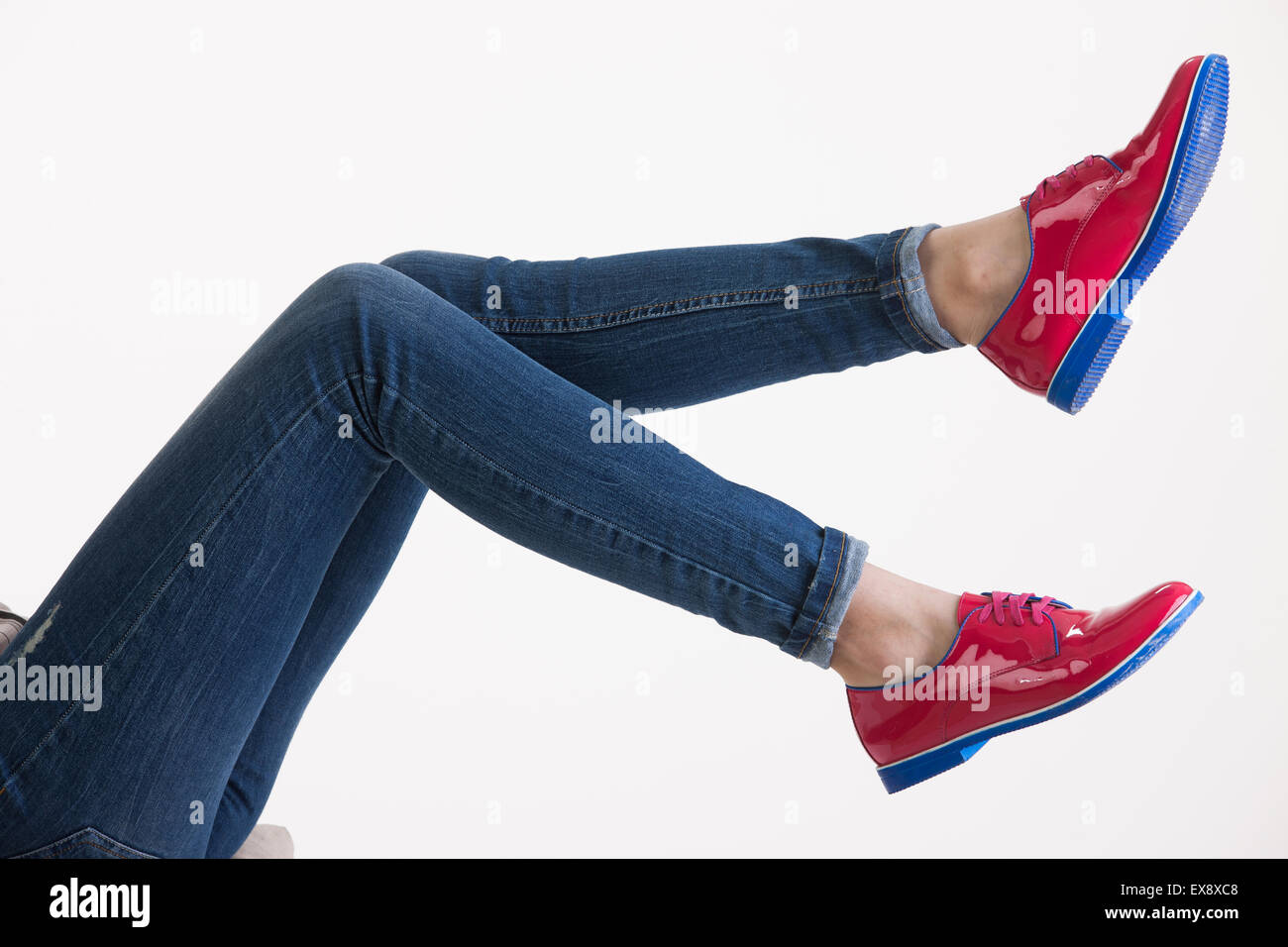 woman women people one leg jeans denim blue isolated shoes red white ...