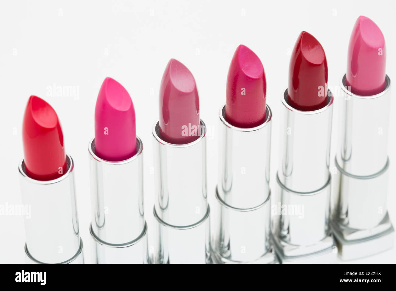 Various lipsticks on white background Stock Photo - Alamy