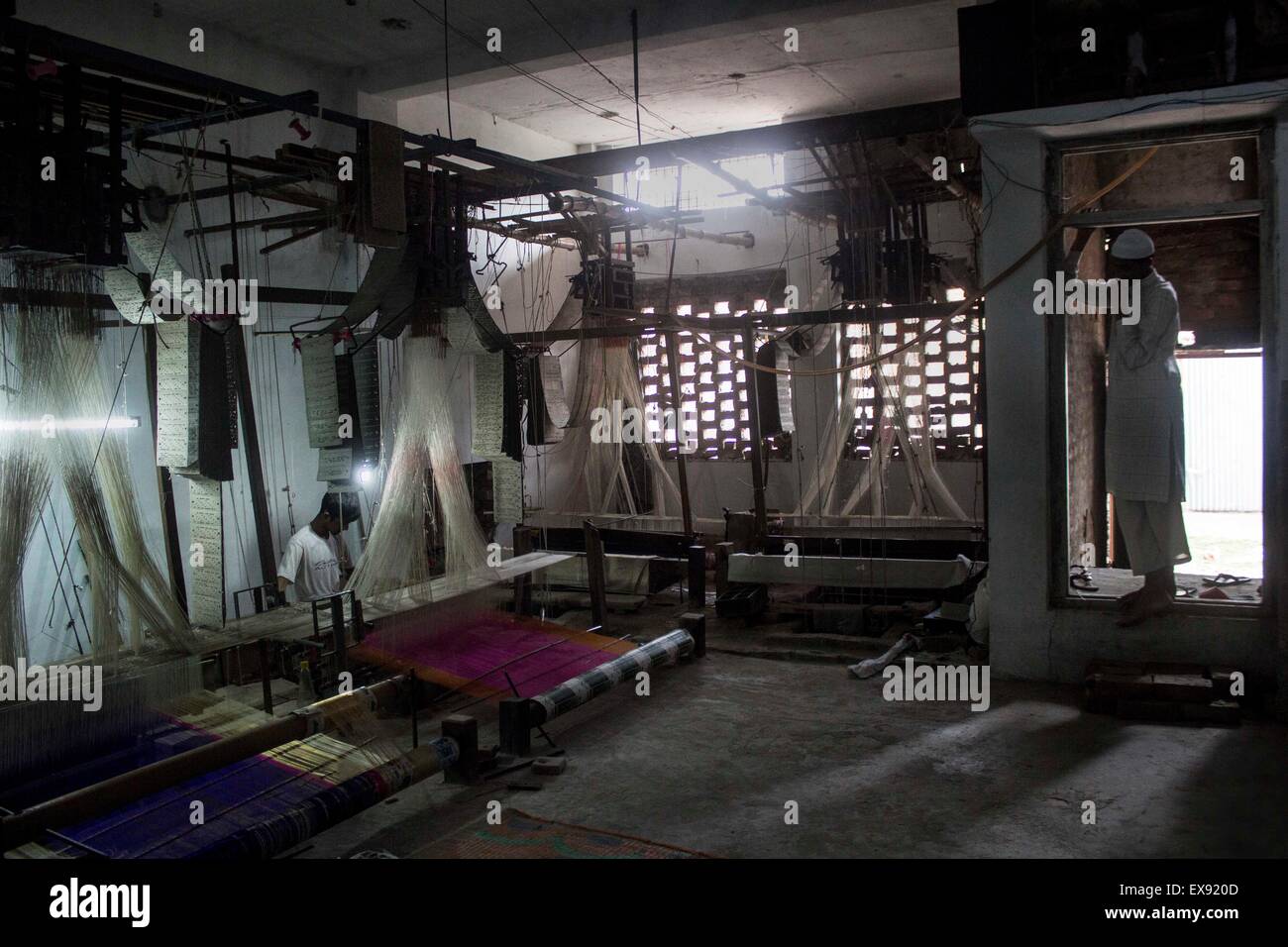 A 22 years old veteran weaver, Abu Umair works in a handloom factory ...