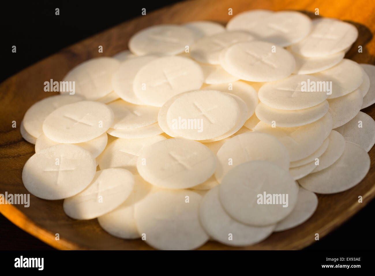 Communion wafers in bowl Stock Photo - Alamy