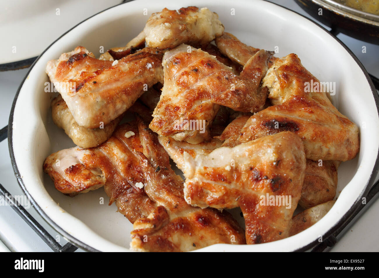 juicy slices of chicken baked on a grill lie on a plate Stock Photo - Alamy