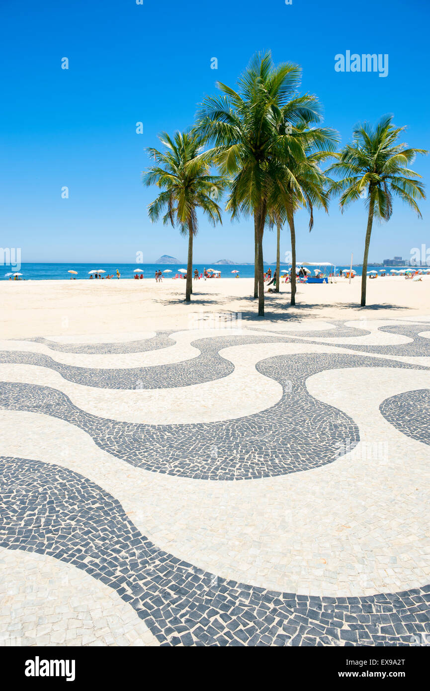 Iconic sidewalk tile pattern with palm trees at Copacabana Beach Rio de ...