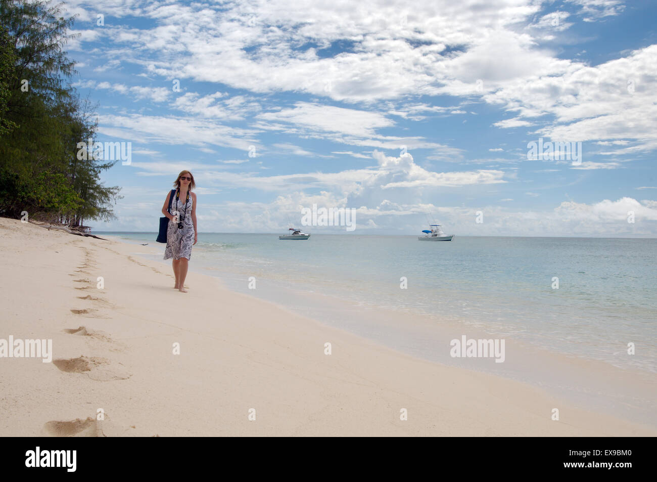 Young woman walking shore sky beach hi-res stock photography and images ...
