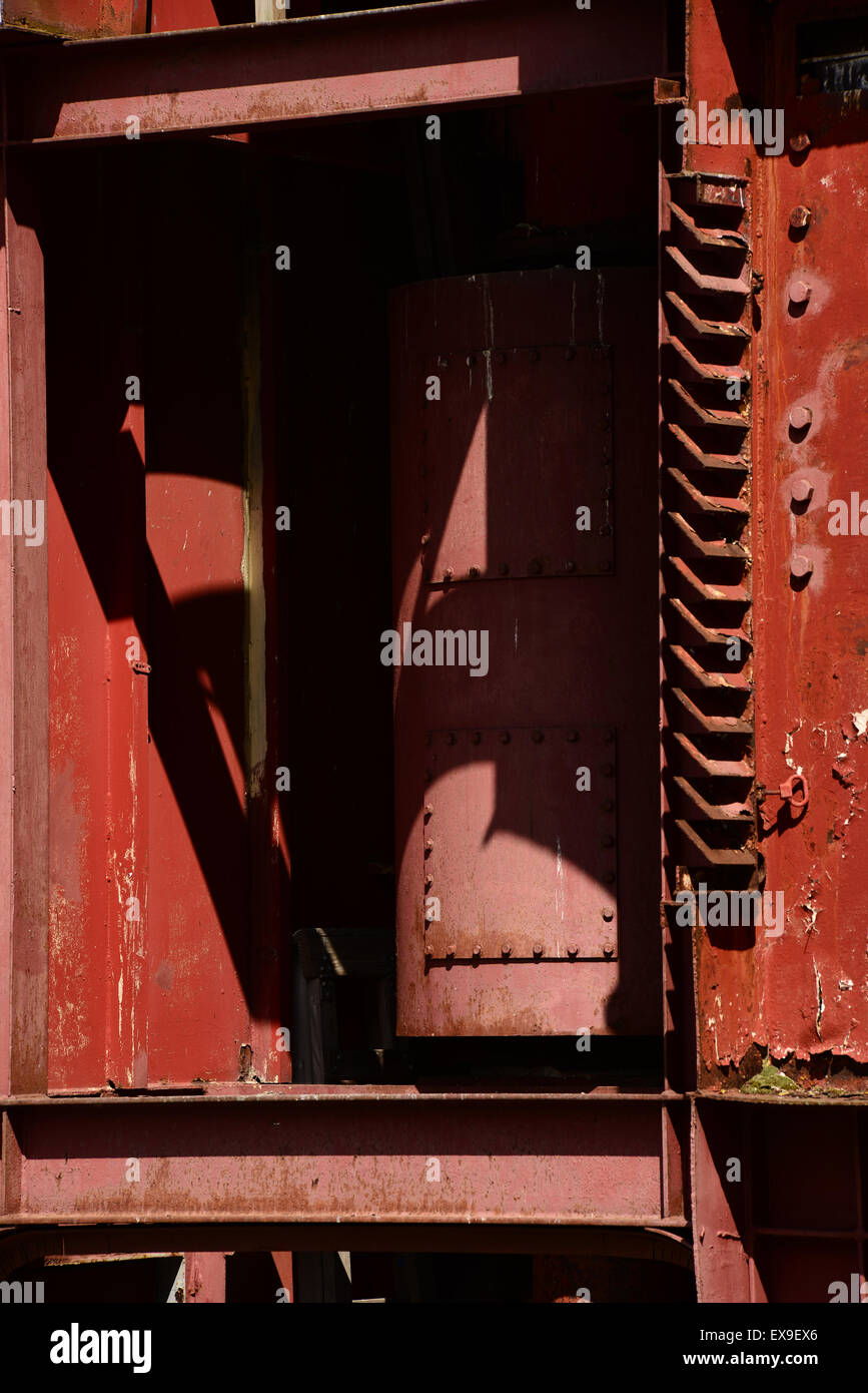 Old metal machinery painted red Stock Photo - Alamy