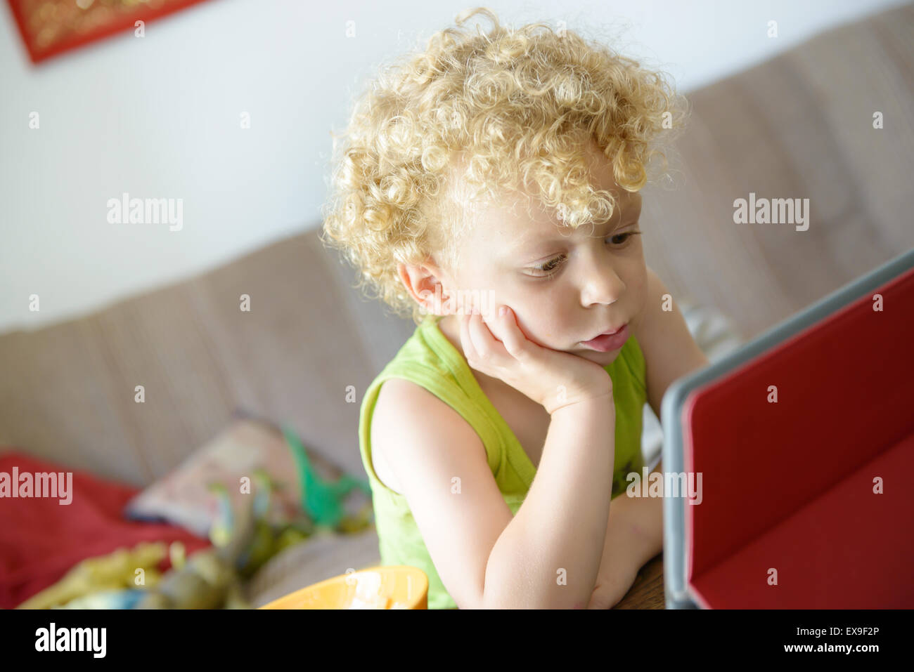 a little child looking at a digital tablet Stock Photo - Alamy