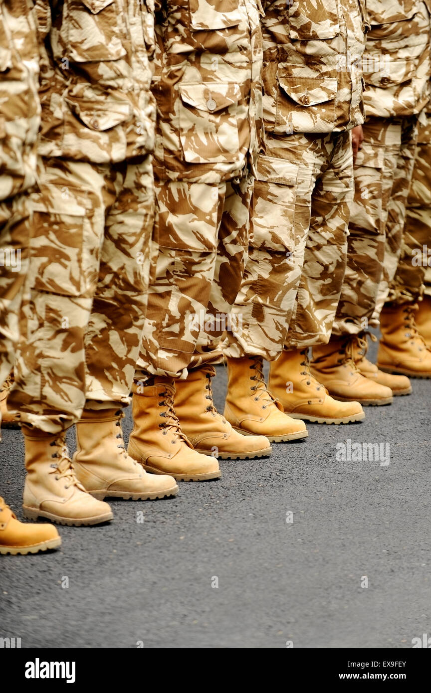 Soldiers feet in desert camouflage military uniform in rest position ...
