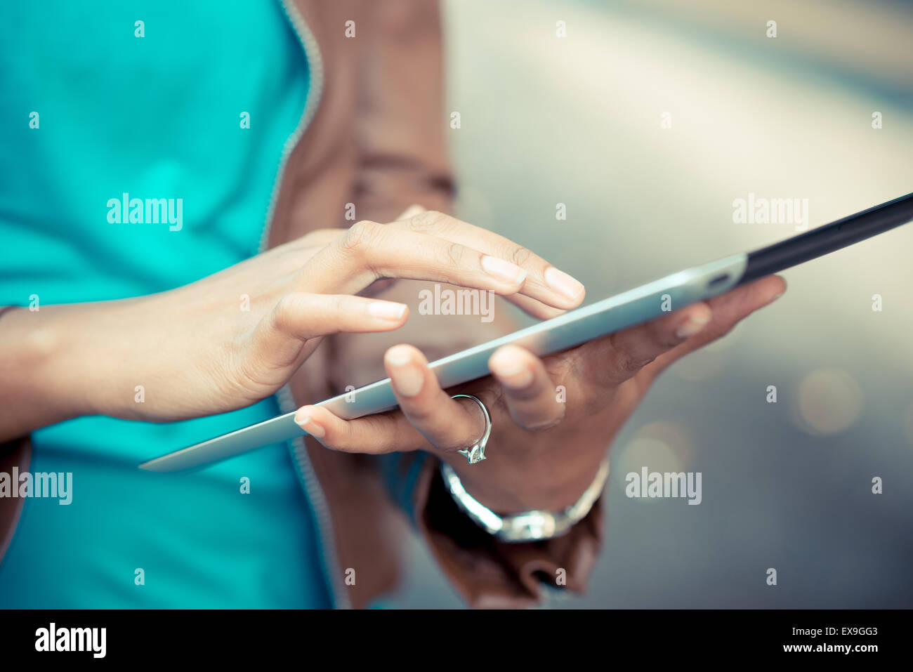 close up of african woman hands using tablet Stock Photo - Alamy