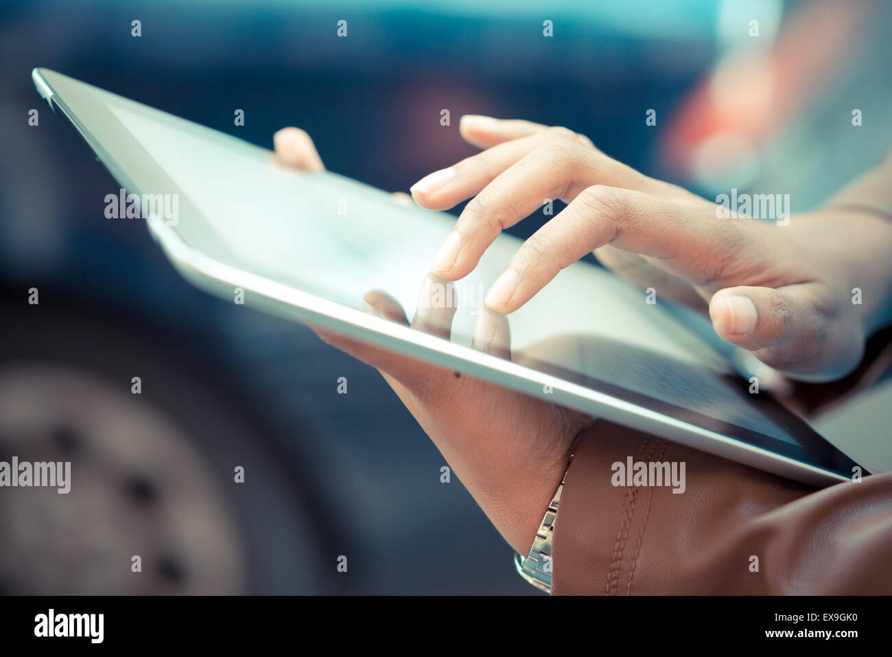 close up of african woman hands using tablet Stock Photo - Alamy