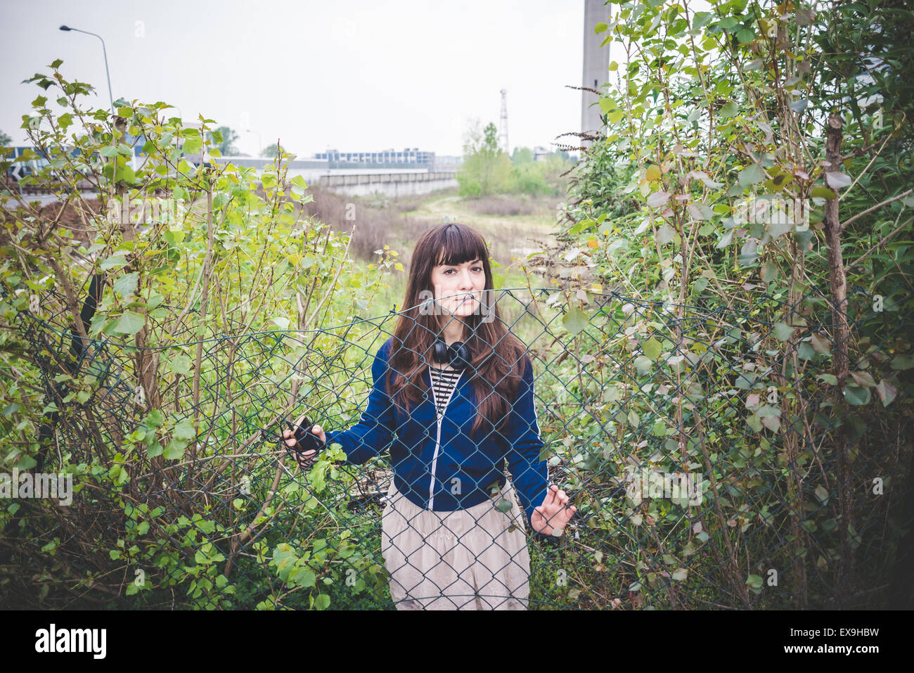 Woman behind a grid hi-res stock photography and images - Alamy