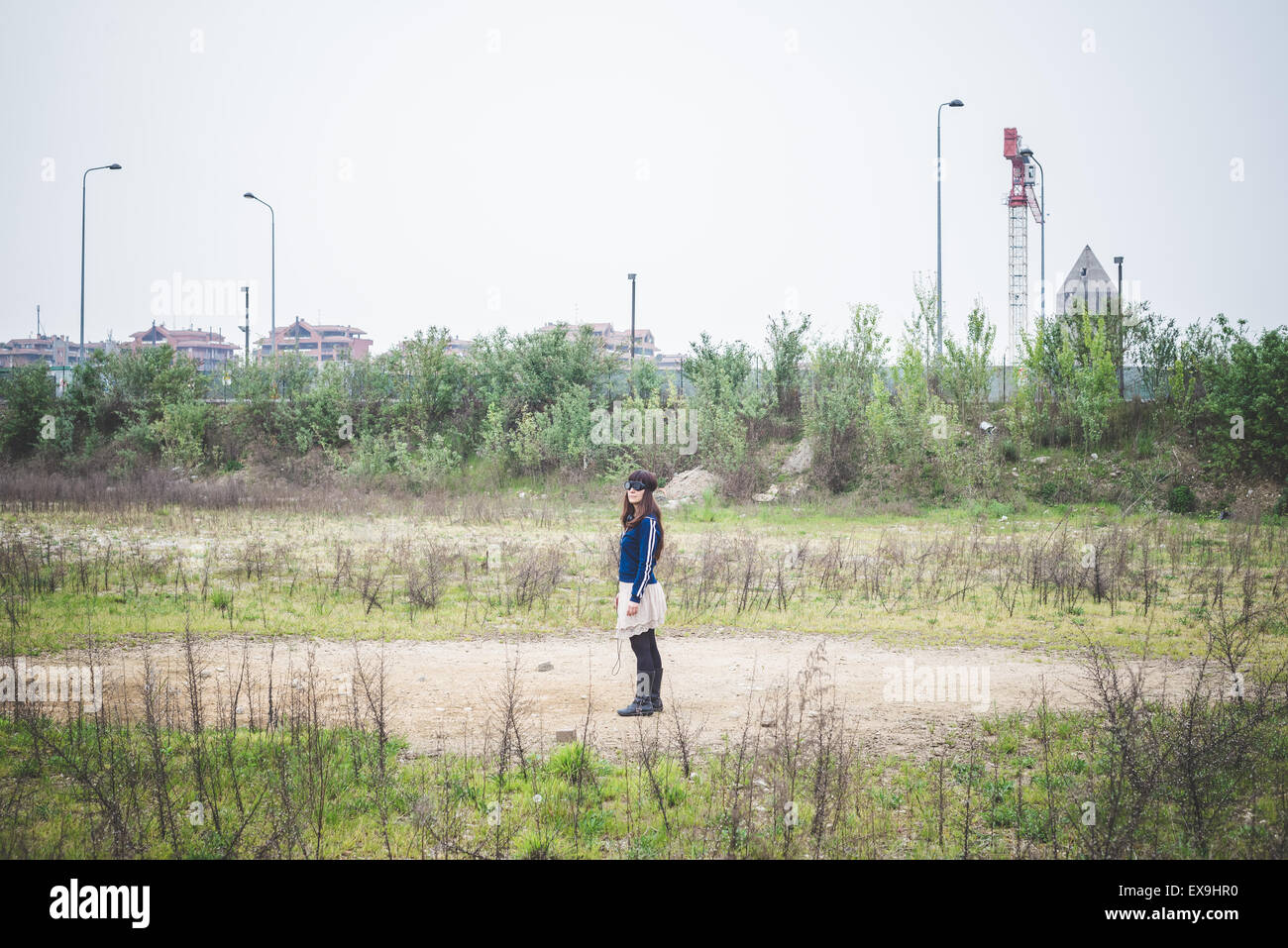 beautiful woman in a desolate lurban landscape Stock Photo - Alamy