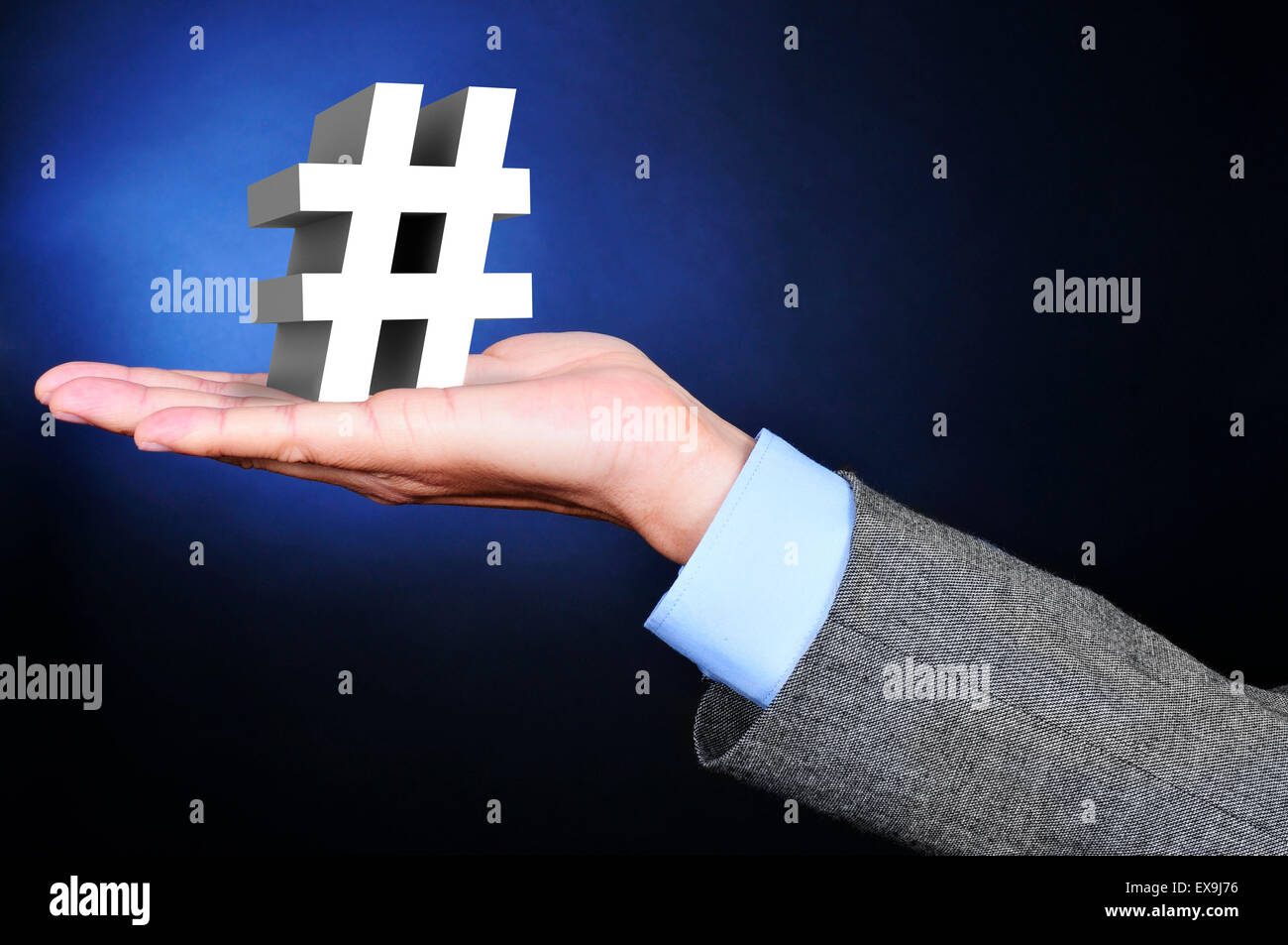 closeup of a young caucasian businessman in a gray suit showing a 3D ...