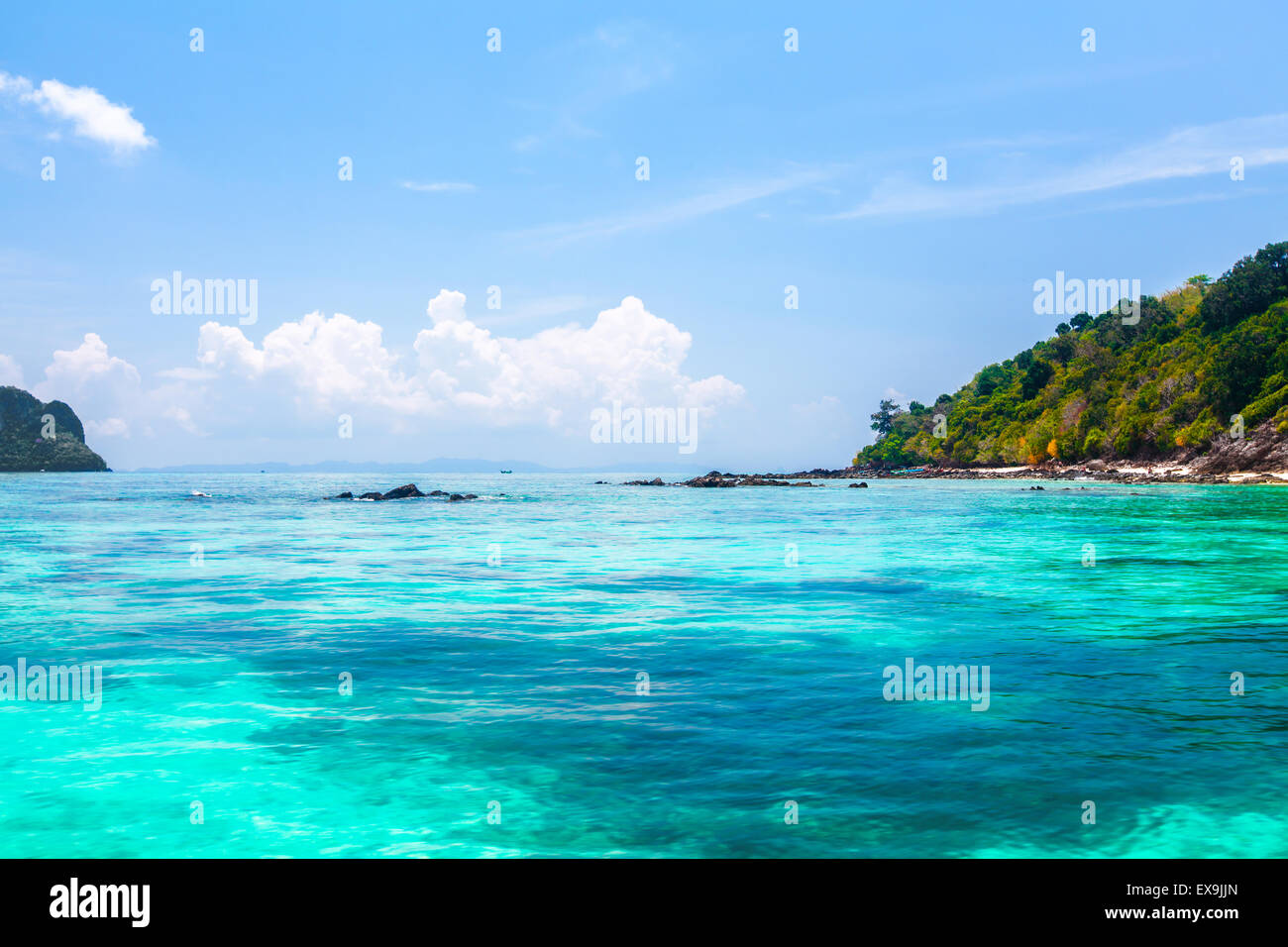 Big green rock island on blue tropical sea Philippines Stock Photo - Alamy