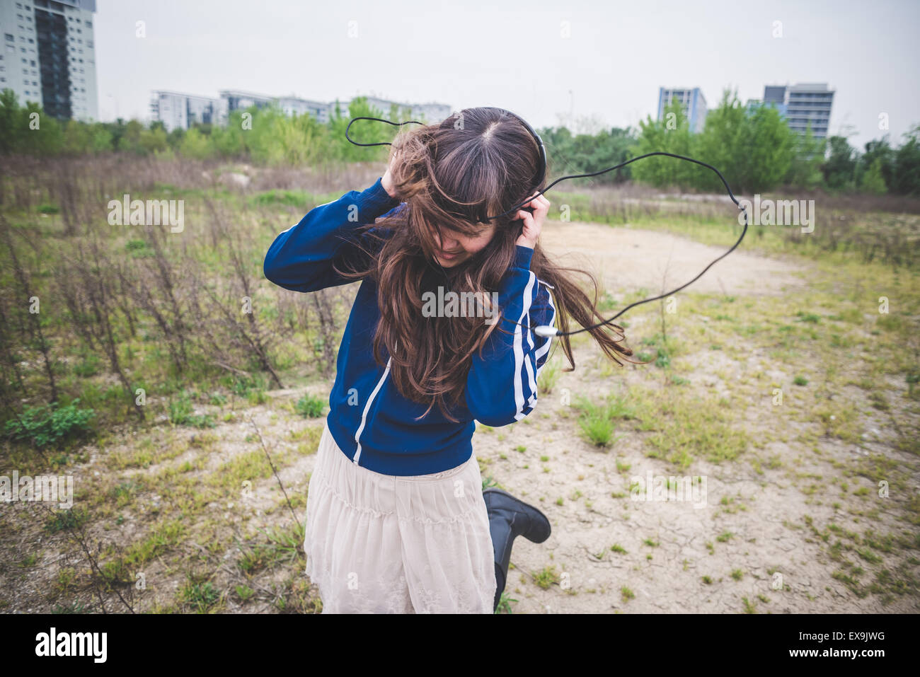 beautiful woman dancing in a desolate lurban landscape Stock Photo - Alamy