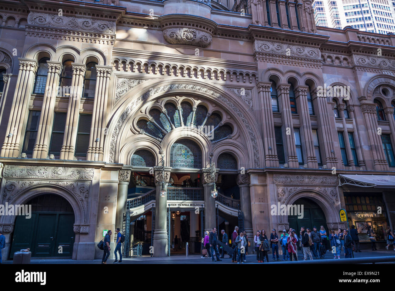 People queuing for bus in front of QVB, Queen Victoria Building, Sydney ...
