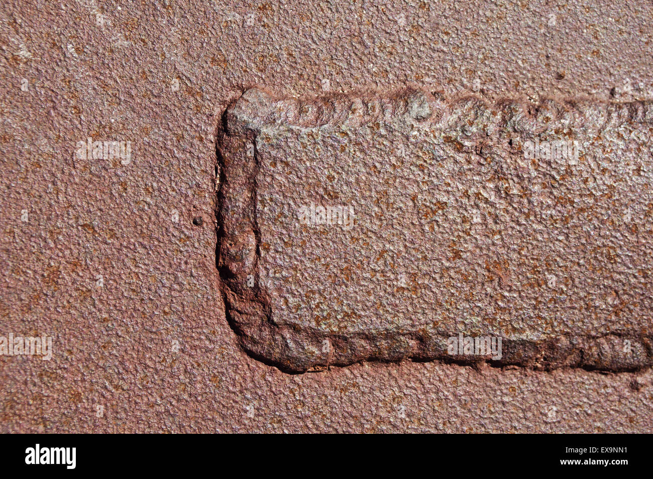 welded patch on old rusty corroded iron background Stock Photo - Alamy
