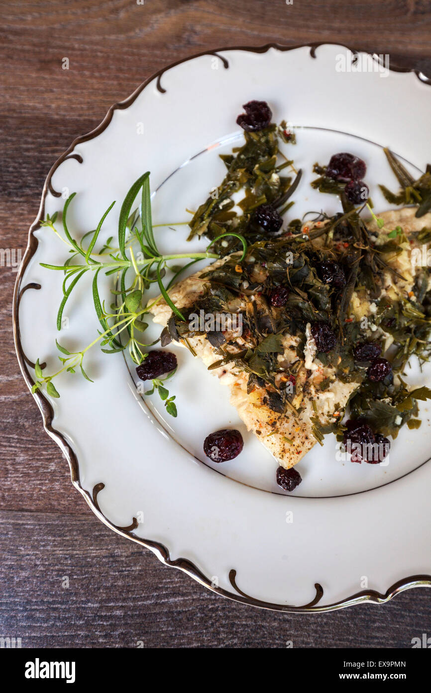 Baked cod with cranberries, thyme and rosemary Stock Photo - Alamy