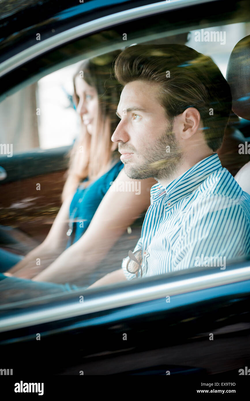 young beautiful couple lovers in the car Stock Photo - Alamy