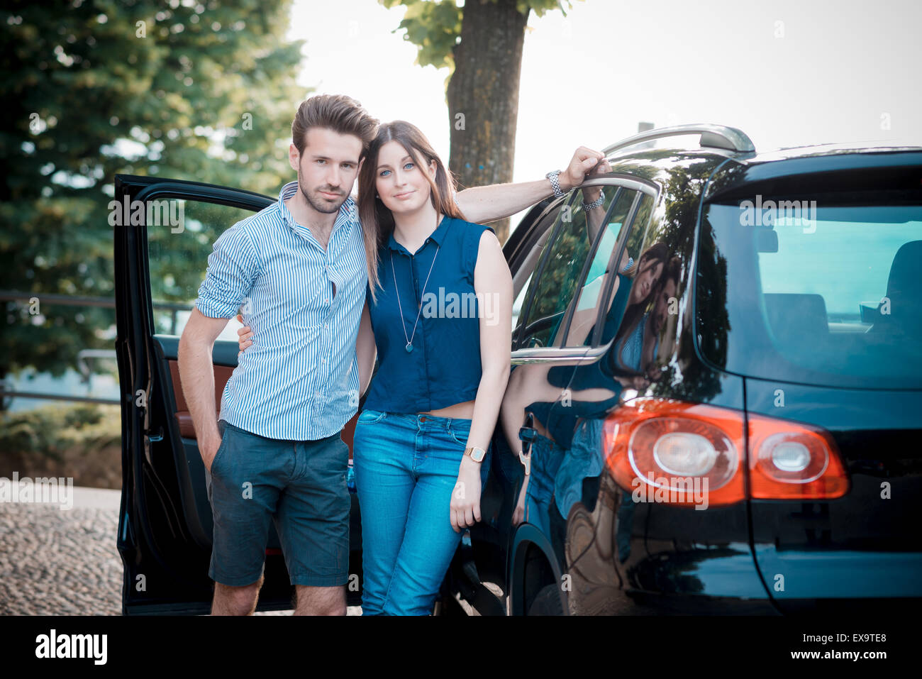 young beautiful couple lovers in the car Stock Photo - Alamy