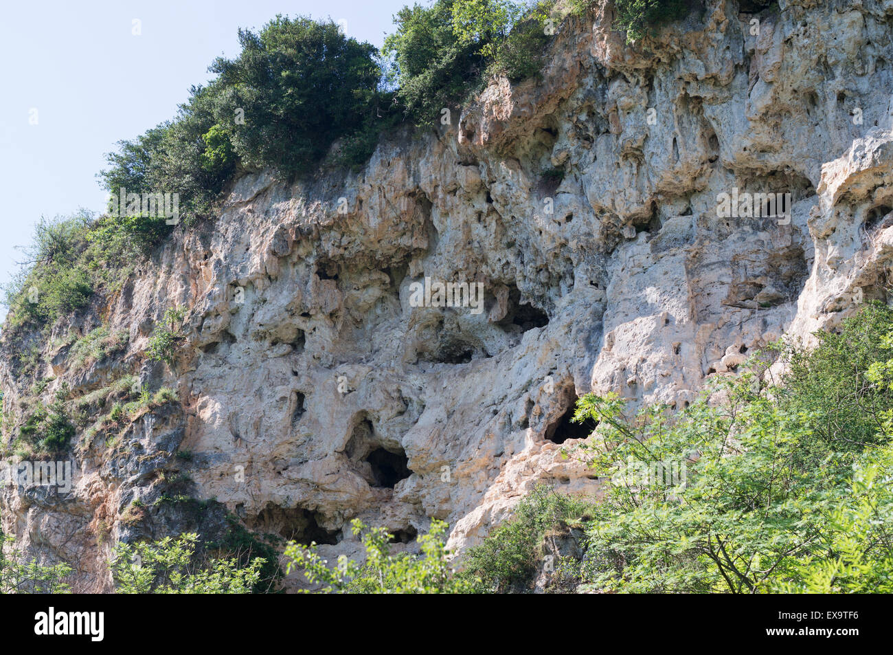 Karst limestone cliff near the waterfall at Creissels, Millau, Averyon ...