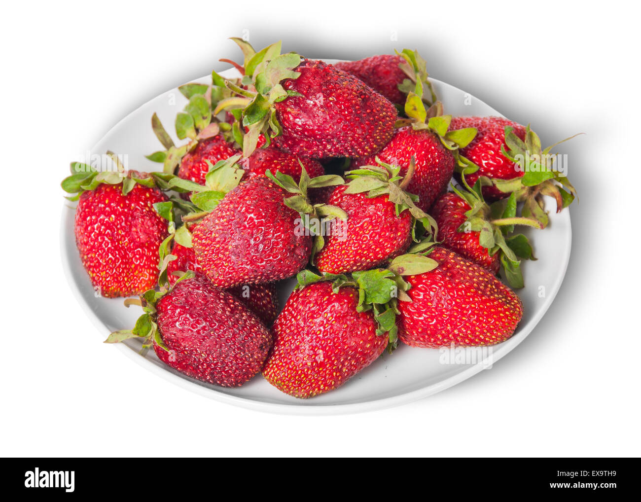 Front and top pile of fresh strawberries on white plate isolated on ...
