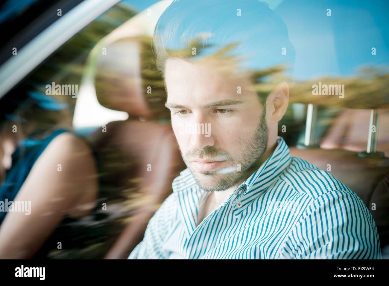 Man with short hair driving hi-res stock photography and images - Alamy
