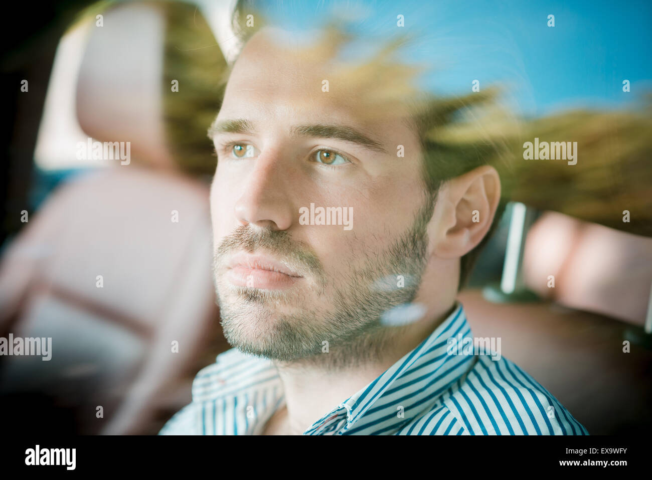 Man with short hair driving hi-res stock photography and images - Alamy