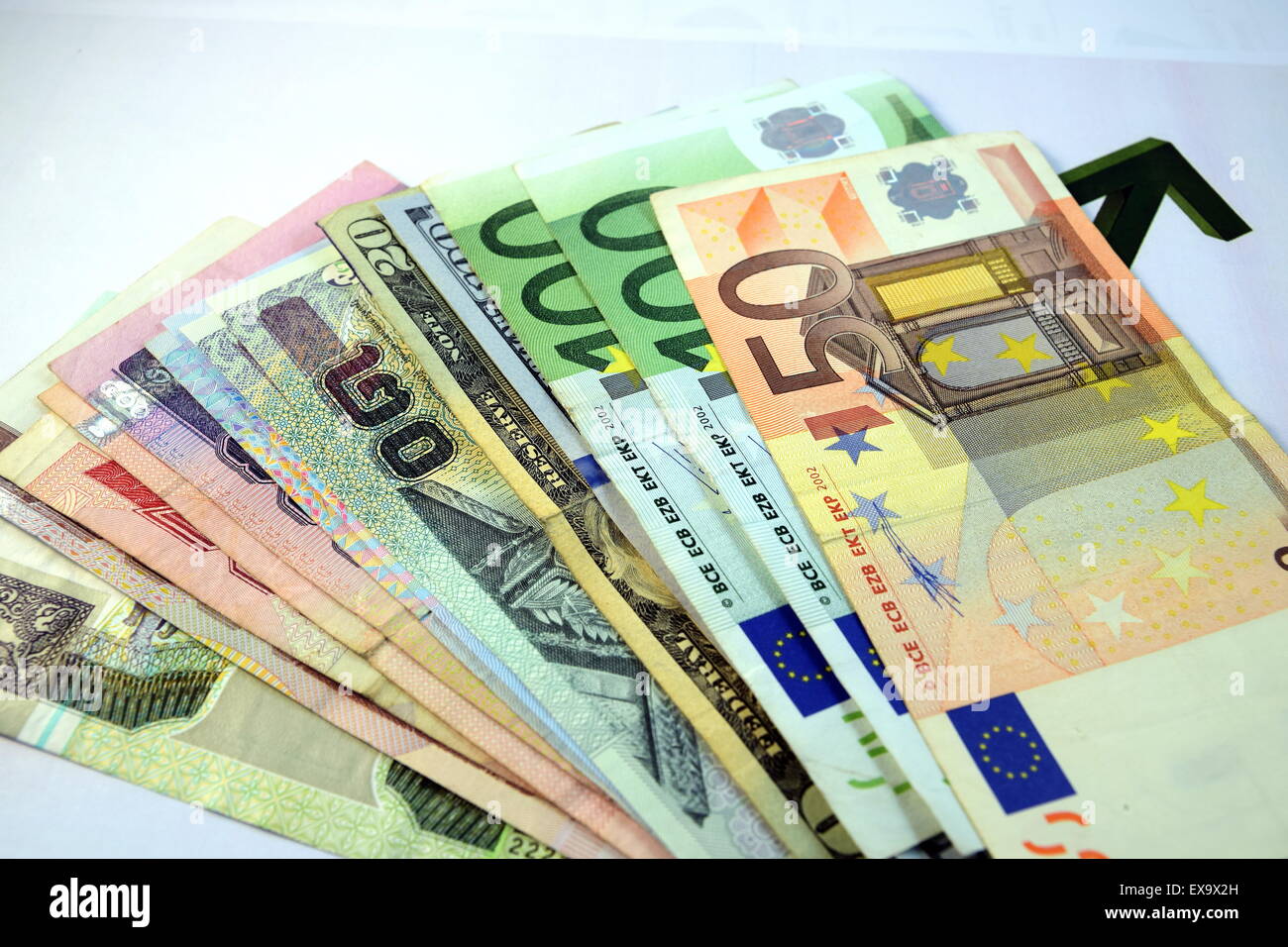 Close up of Various currency notes and coins from different countries ...