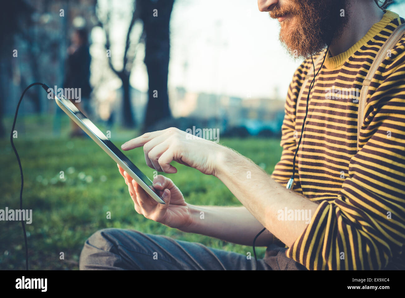 close up of man hands using tablet outdoors Stock Photo - Alamy