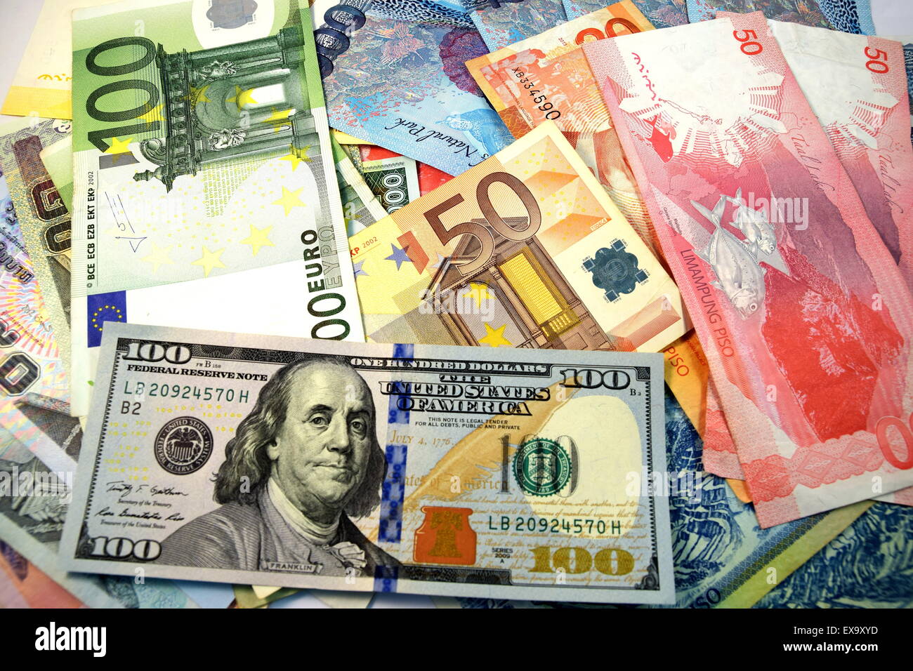 Close up of Various currency notes and coins from different countries ...