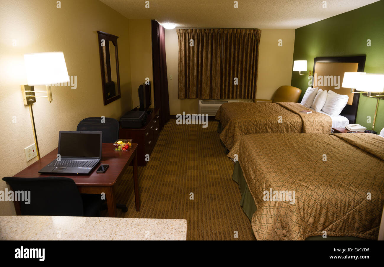 An upscale hotel room with kitchen and desk Stock Photo - Alamy