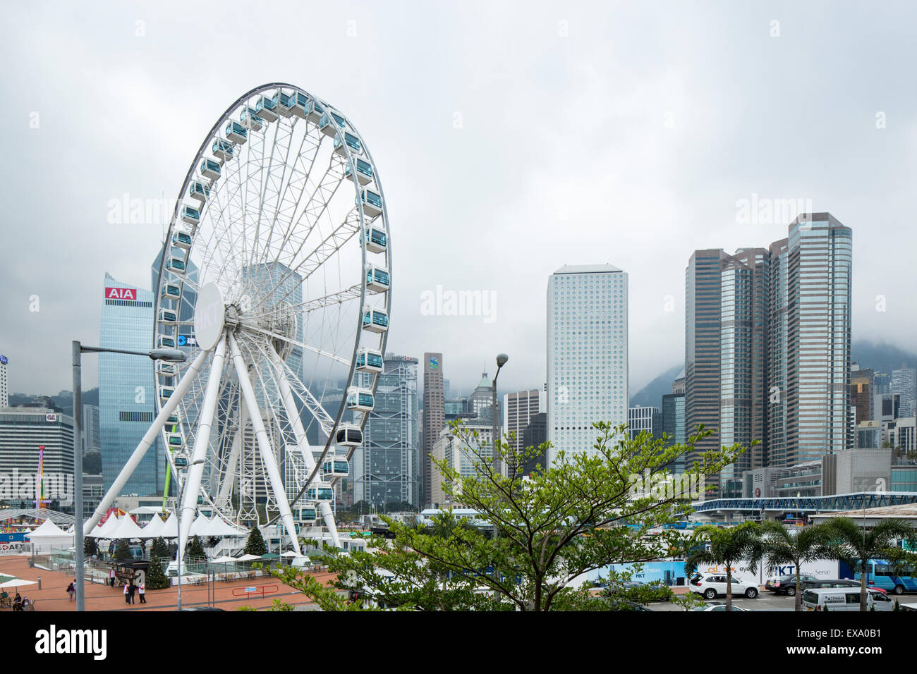 China, Hong Kong, Hong Kong Observation Wheel rises above Central Piers ...
