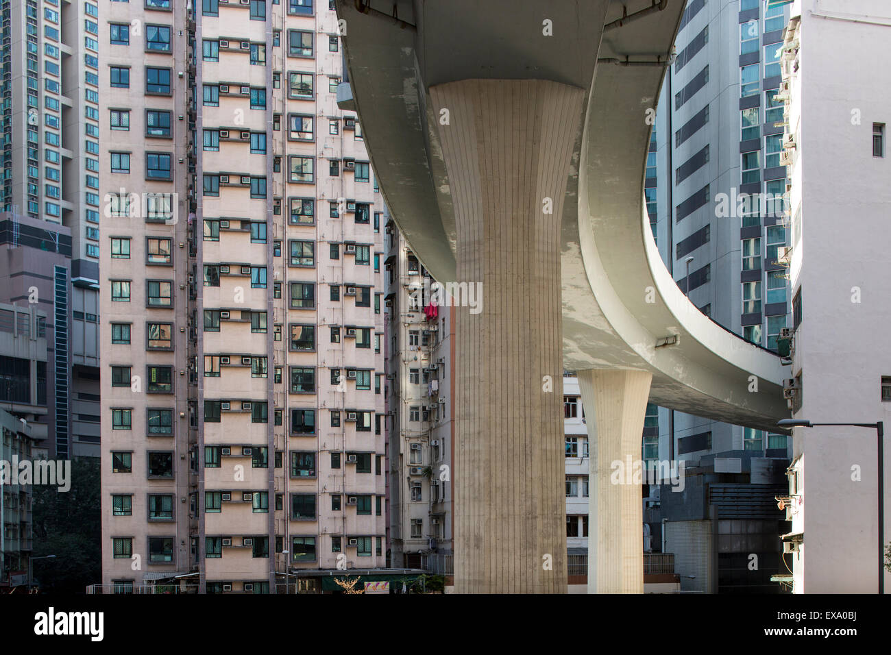 China, Hong Kong, Highway overpass and surrounding high rise apartment ...