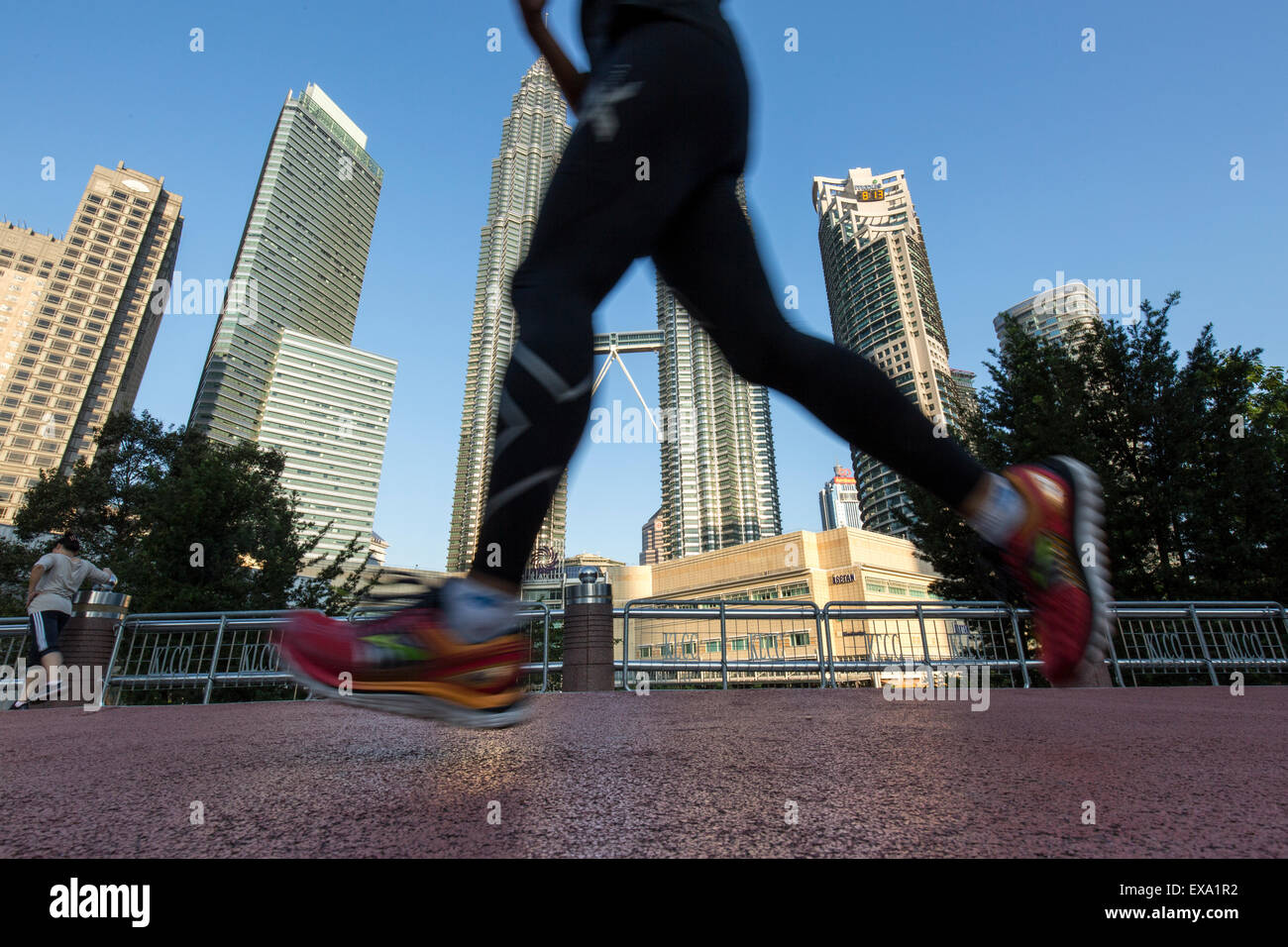 Malaysia, Kuala Lumpur, Low angle view of jogger running on trail in ...