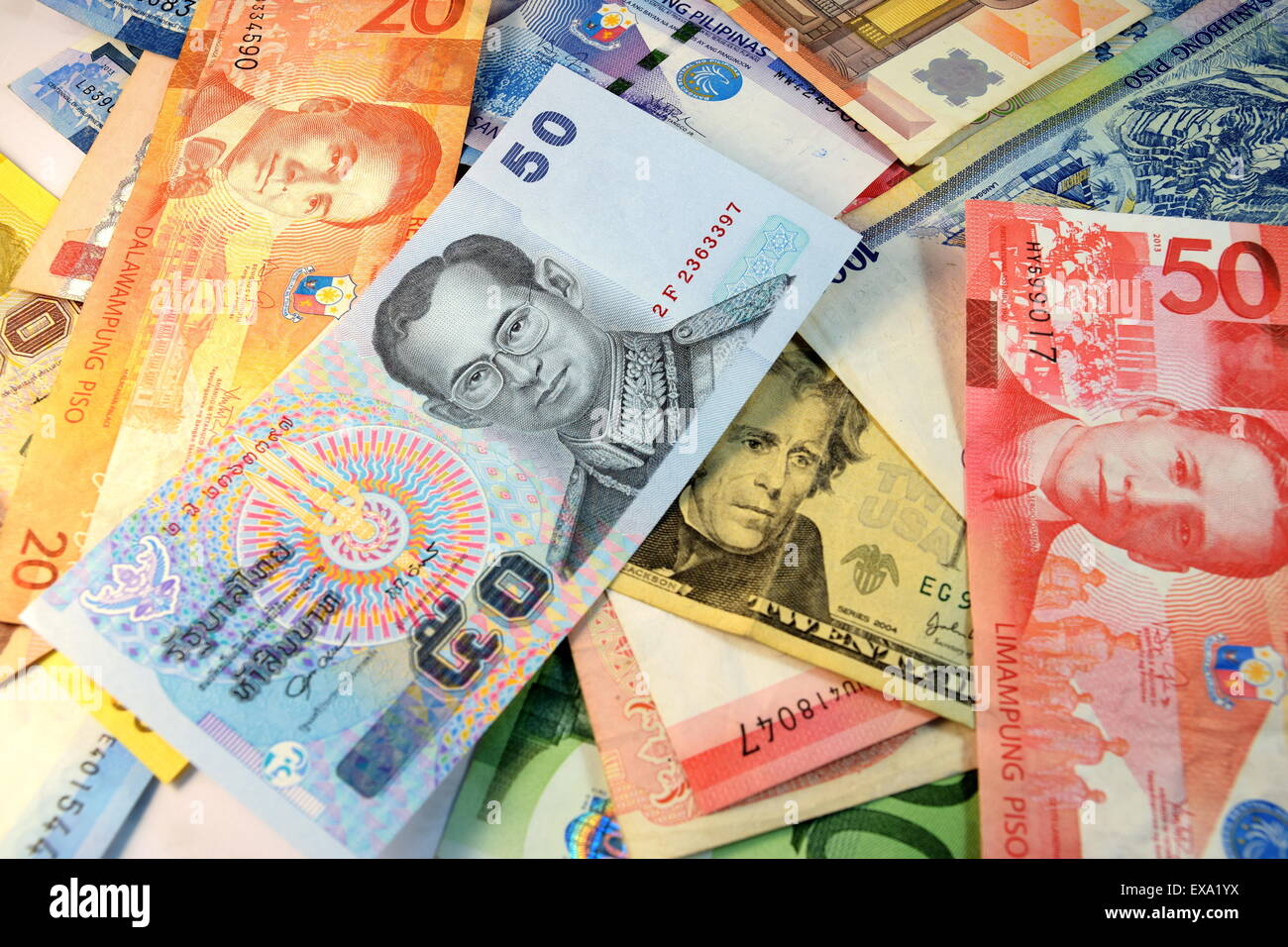 Close up of Various currency notes and coins from different countries ...