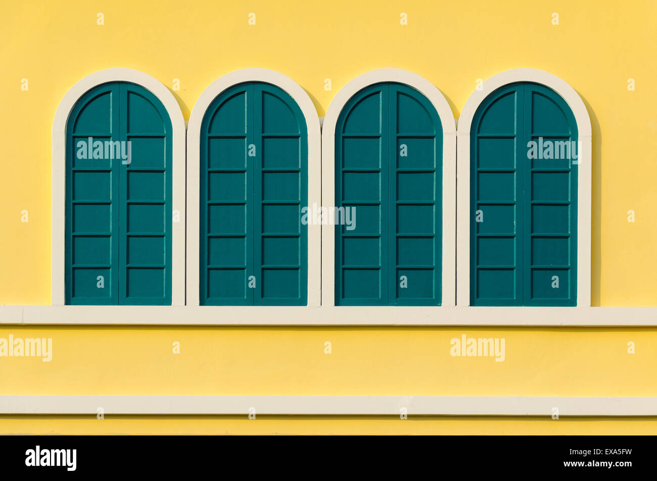 Vintage green window on the yellow wall Stock Photo - Alamy