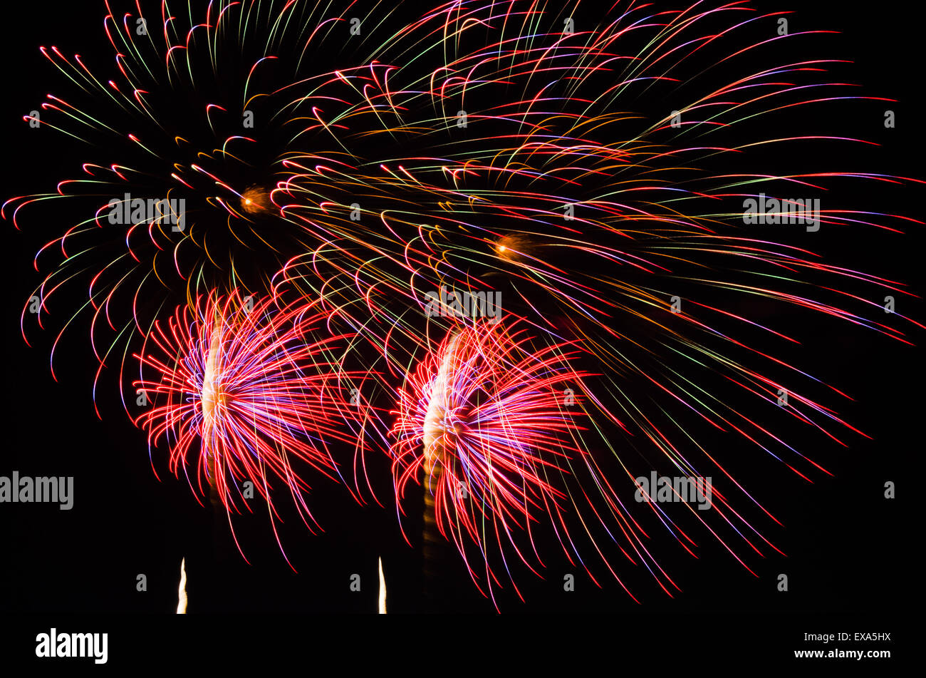 An image of exploding fireworks at night. Represents a celebration ...