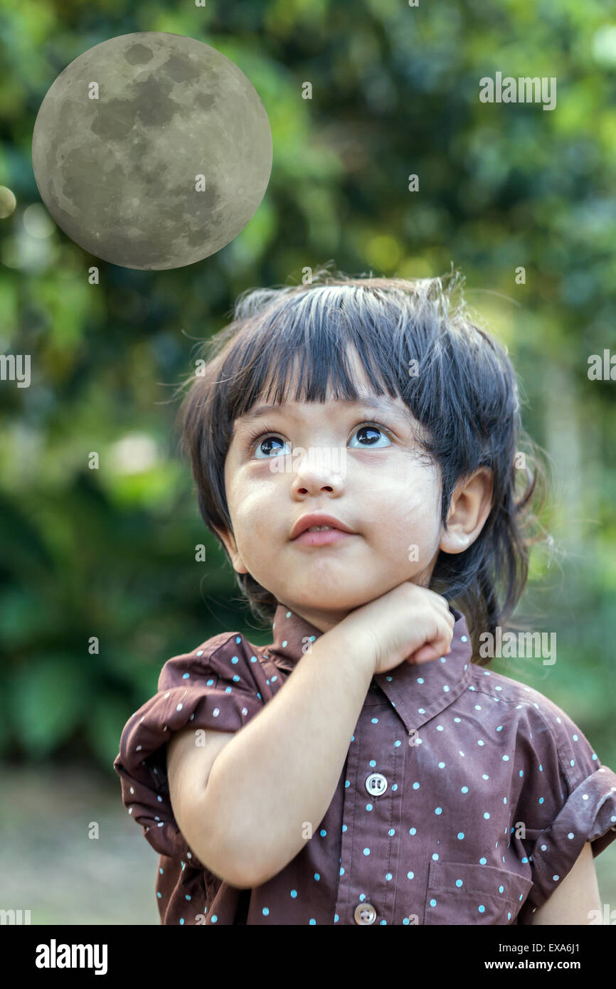 Portrait of Asian cute little boy looking up the moon Stock Photo - Alamy