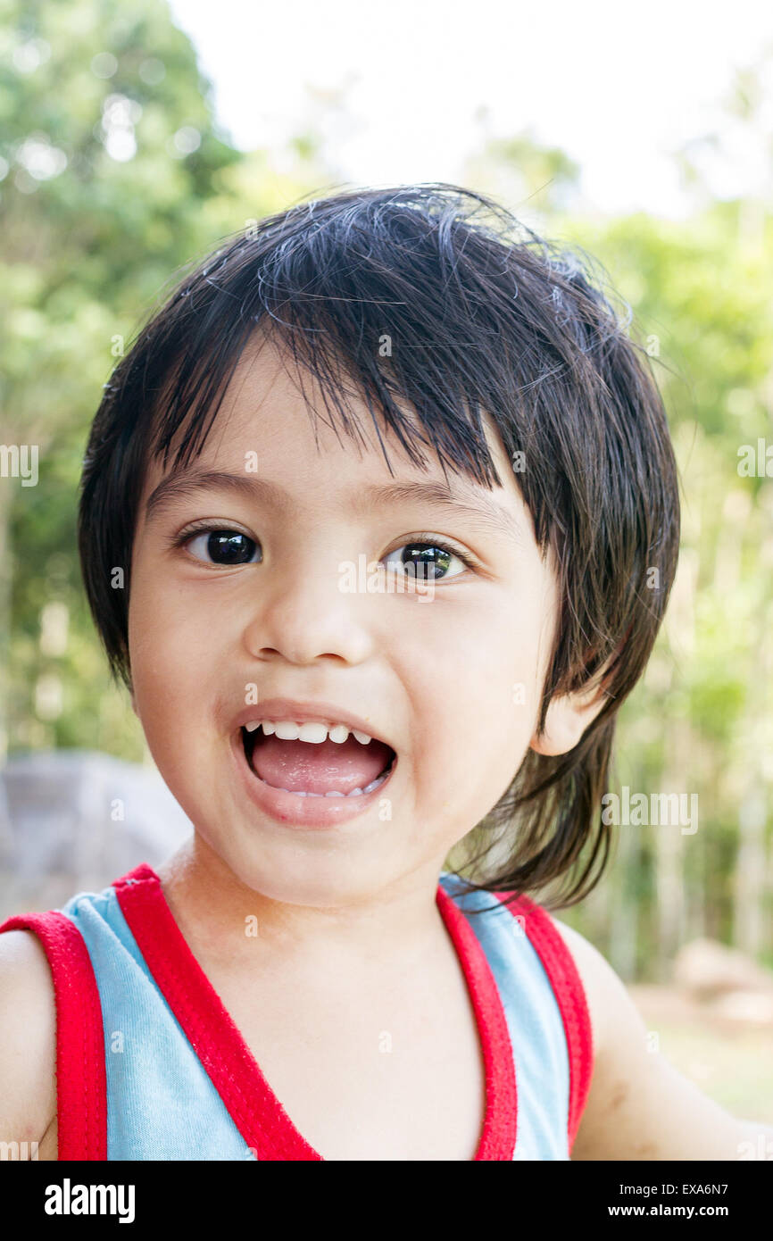 Adorable happy Asian Thai young boy smiling for the camera Stock Photo ...