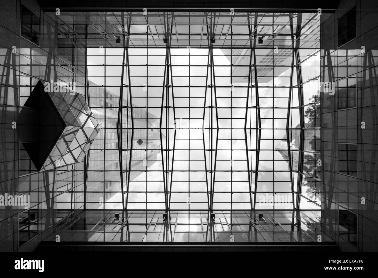 Asia, Singapore, View looking up through glass and steel atrium inside ...