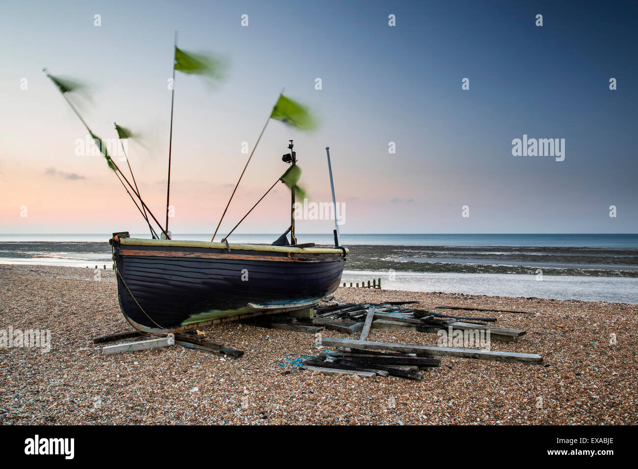 Landscape image of small fishing boats on beach at sunrise Stock Photo ...